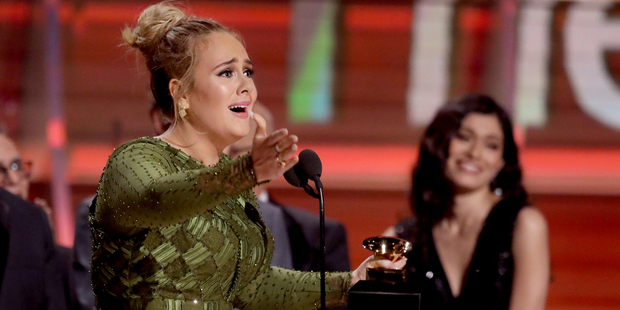 Adele beats Beyonce to sweep Grammys