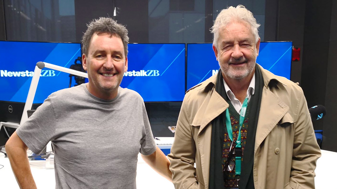 Dr. Simon Rowley with his new book on healthcare in newborns