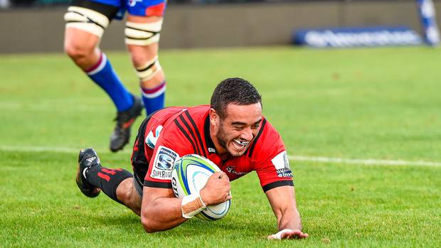 Crusaders halfback Bryn Hall with Newstalk ZB's Lesley Murdoch