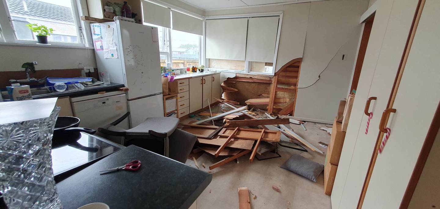 Woman hit by car in own home after vehicle crashes through wall