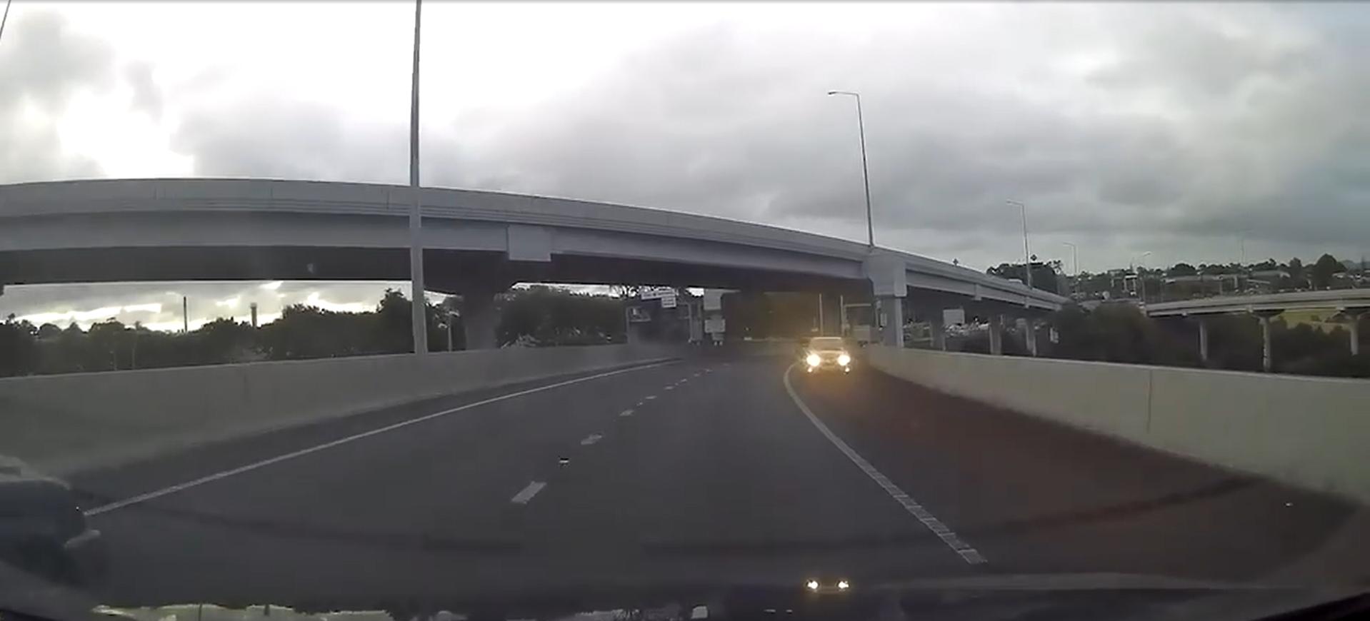 Car travels the wrong way on the motorway in rush hour traffic